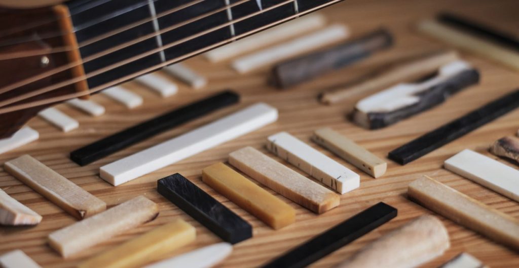 Best Guitar Nut & Saddle Materials & How To Choose